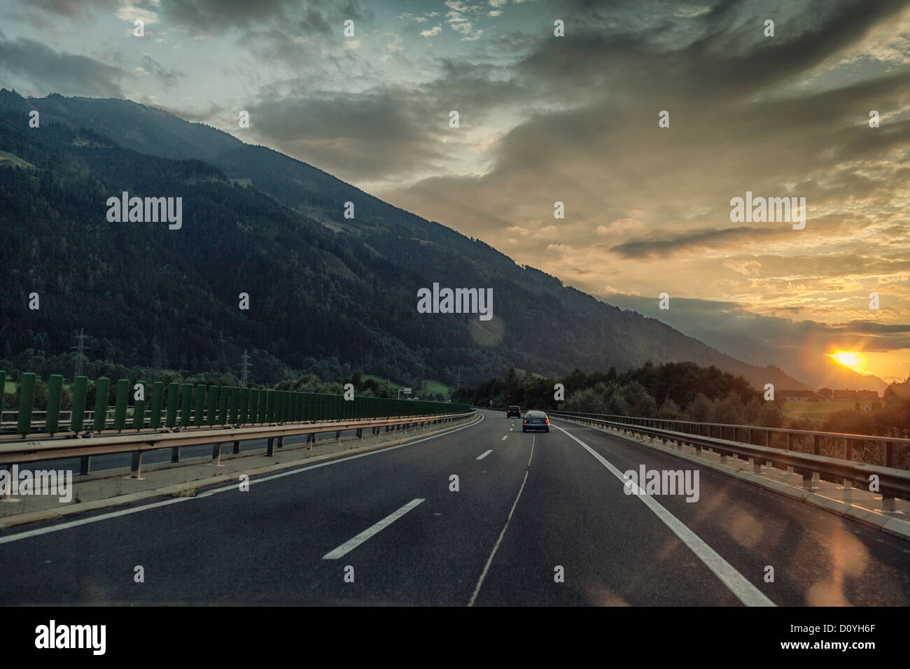 Driving on the motorway in the Austrian Alps Stock Photo - Alamy