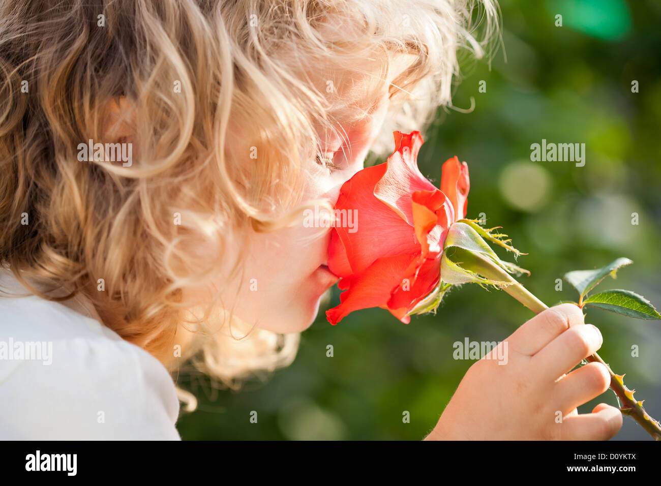 Child with flower Stock Photo - Alamy