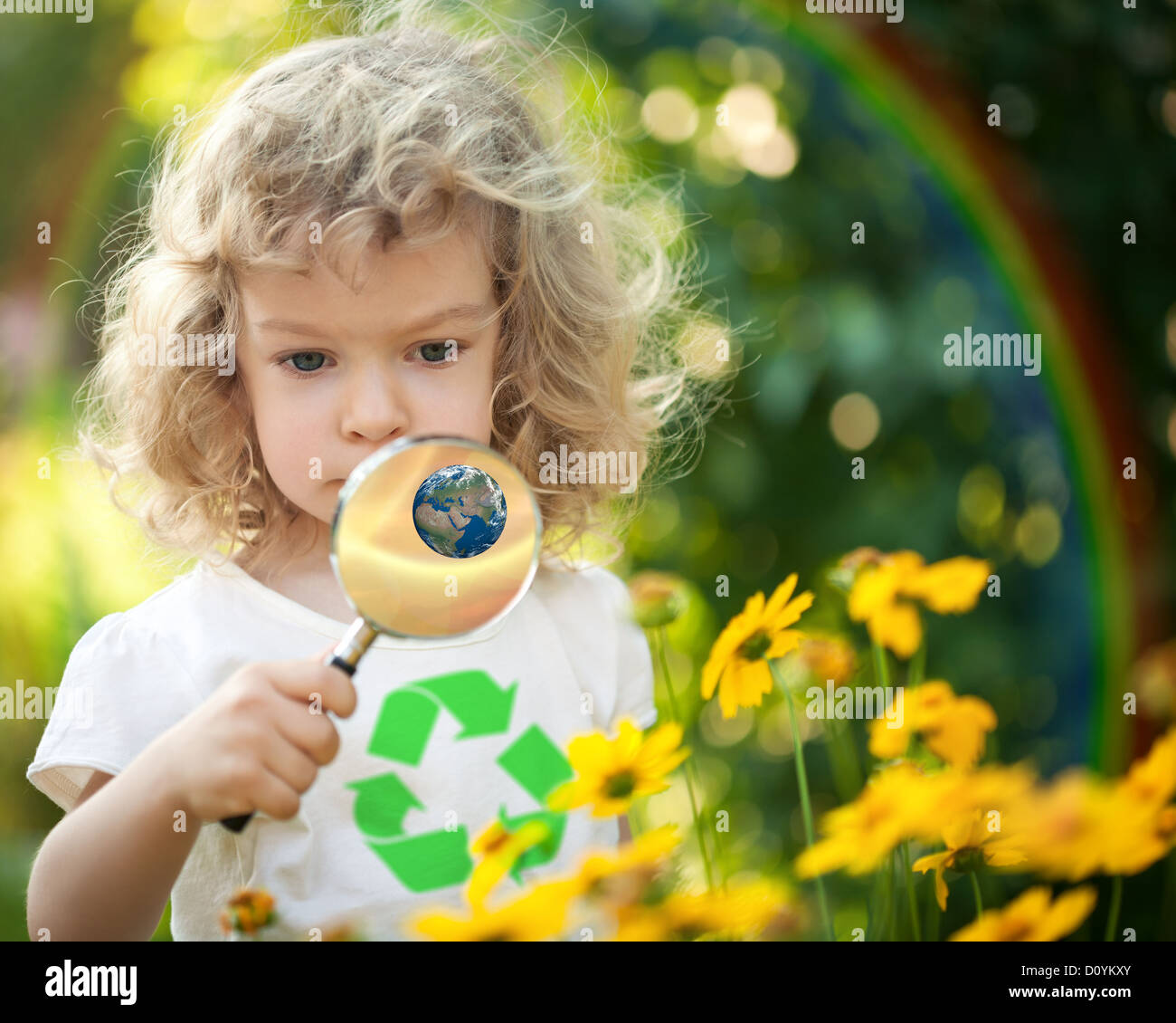 Child looking at spring flowers Stock Photo - Alamy