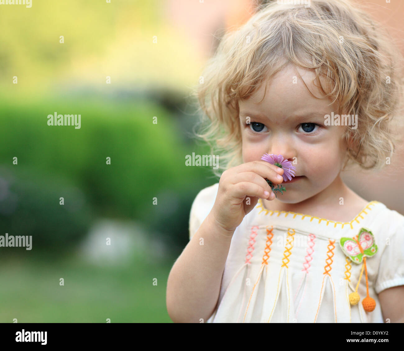 Child in spring garden Stock Photo - Alamy