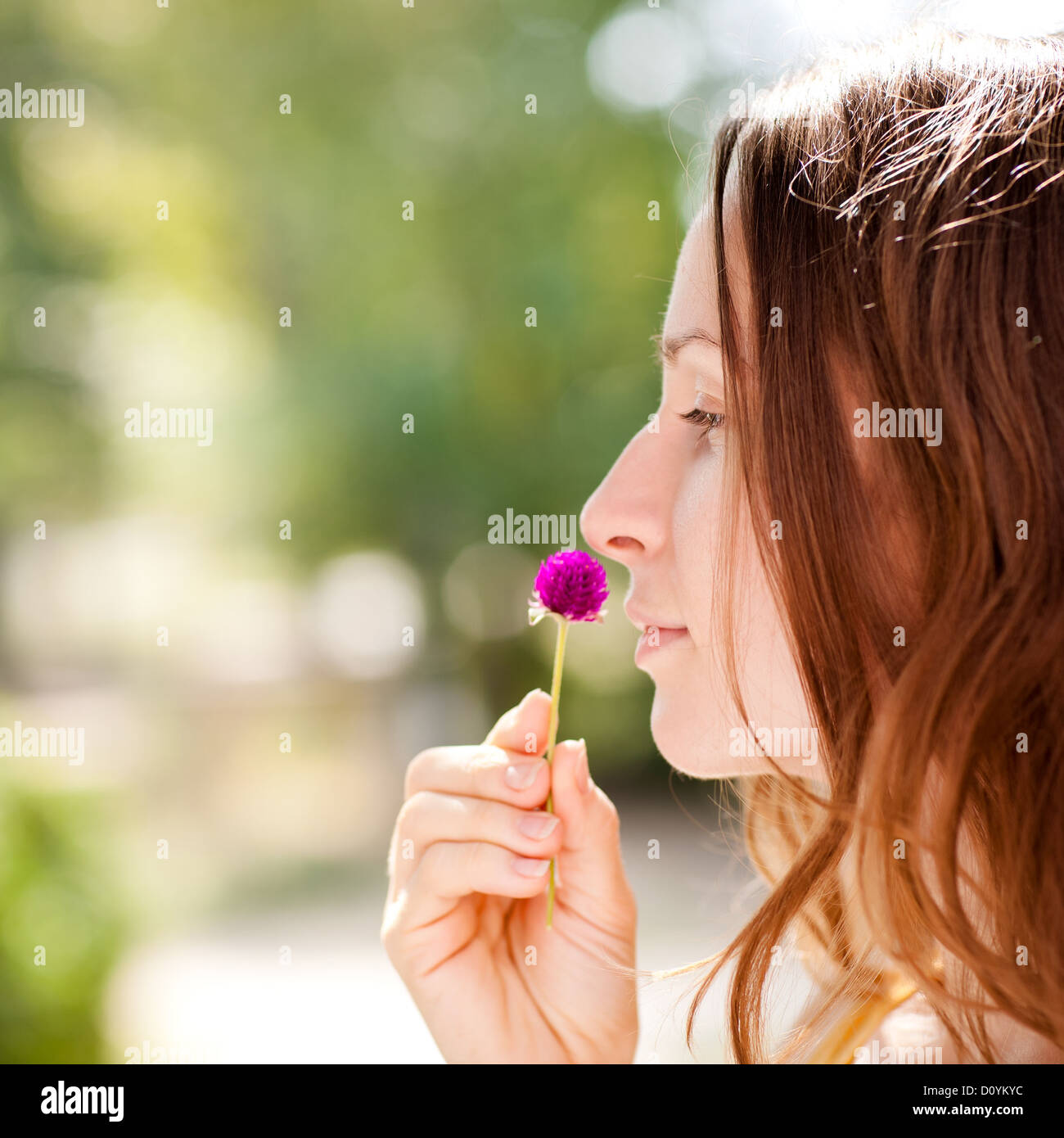 Woman with spring flower Stock Photo - Alamy