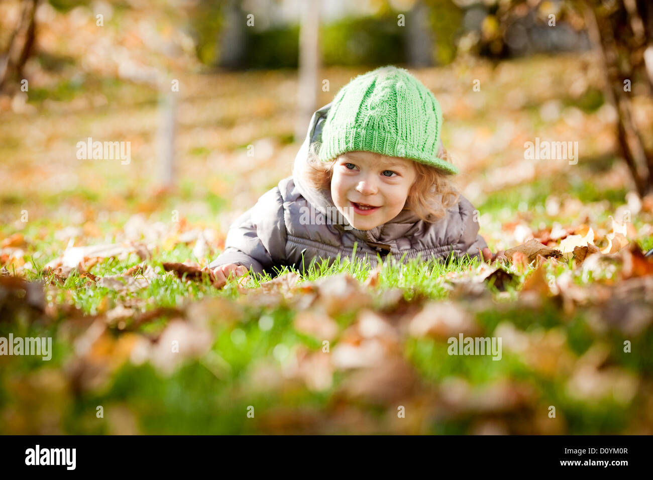 Baby in autumn Stock Photo - Alamy