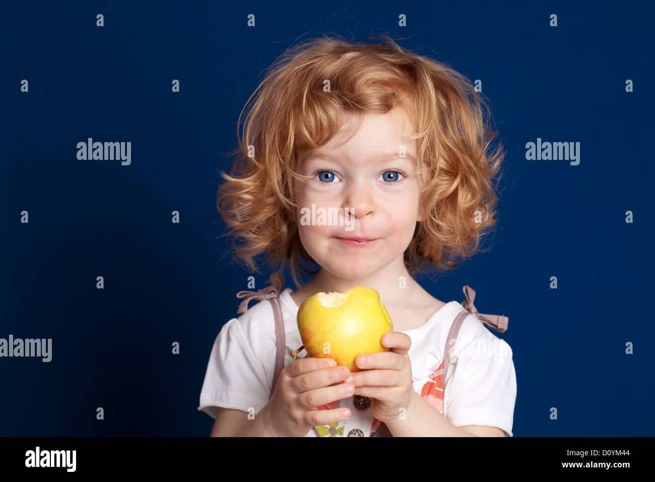 Child with apple Stock Photo - Alamy
