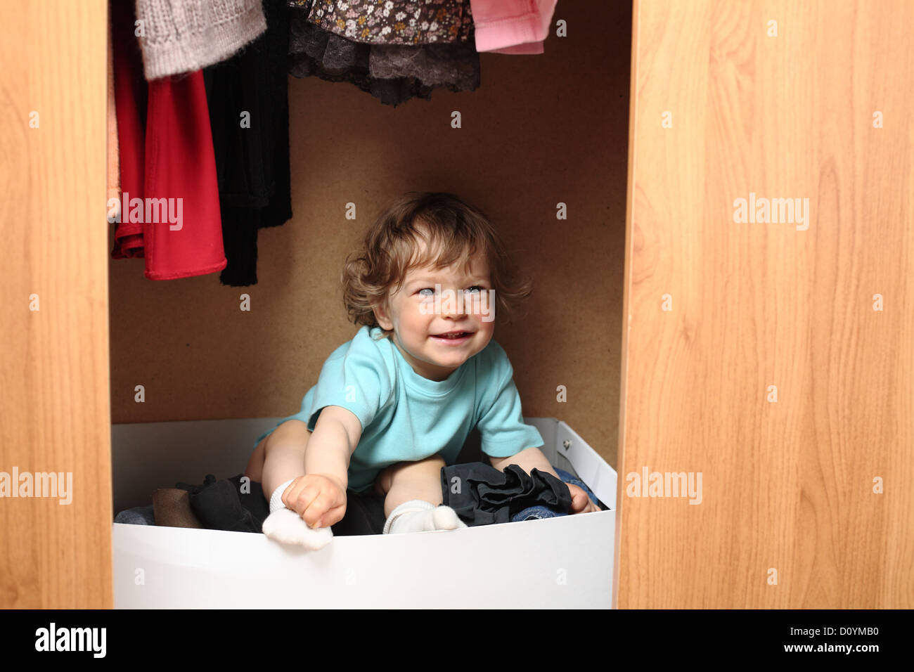 Child in wardrobe Stock Photo - Alamy