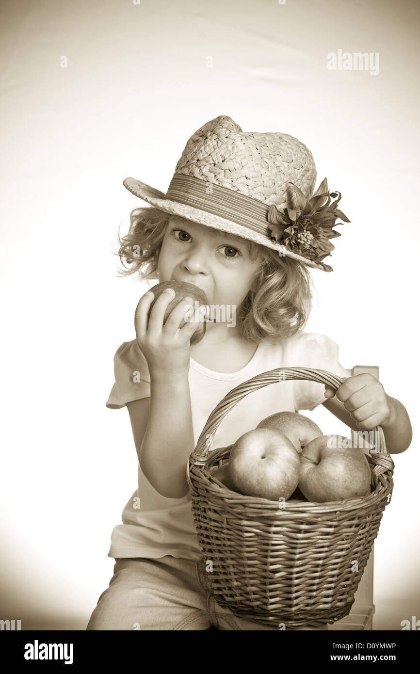 Child eating apple Stock Photo - Alamy