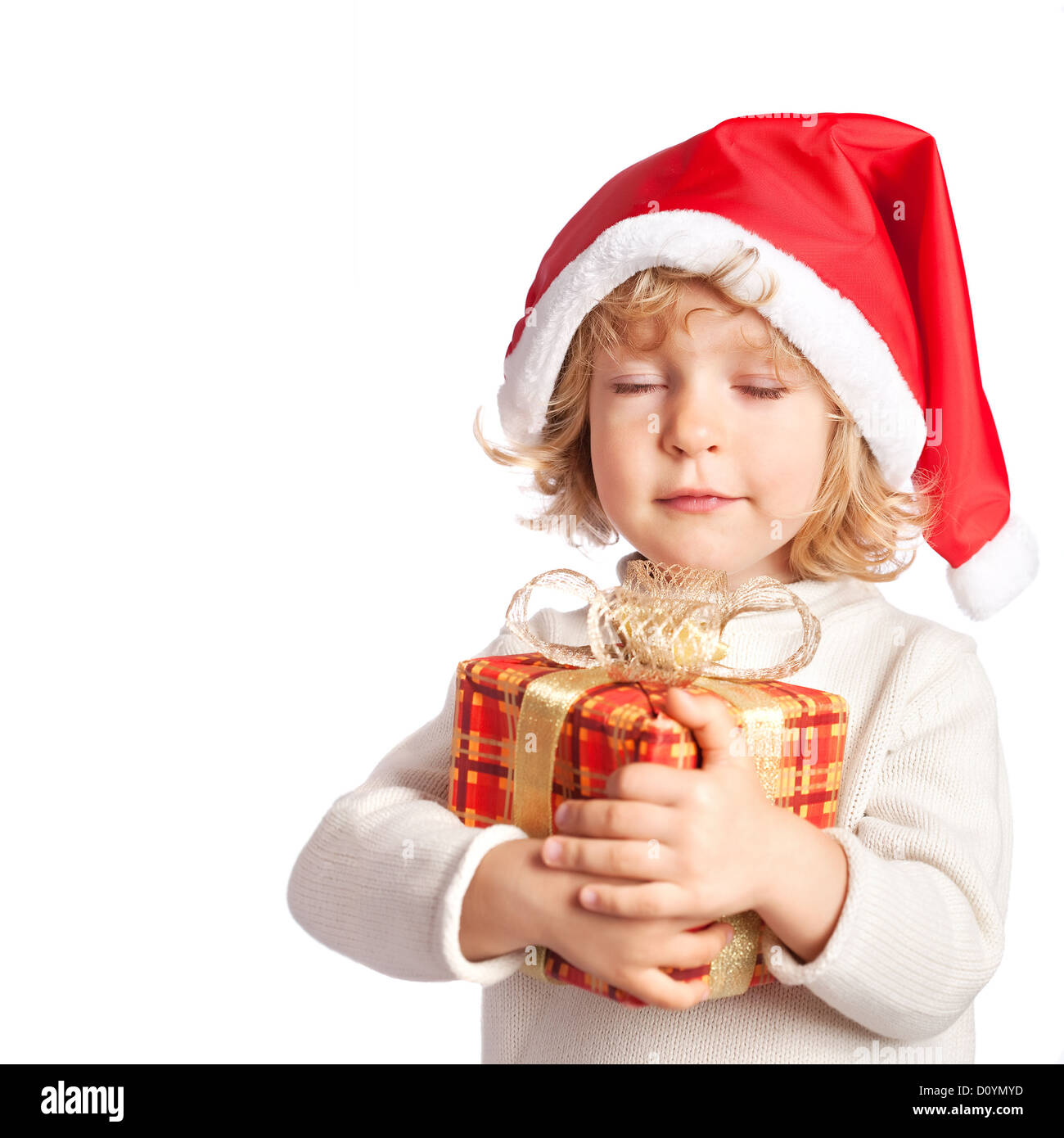 Baby holding Christmas gift Stock Photo - Alamy