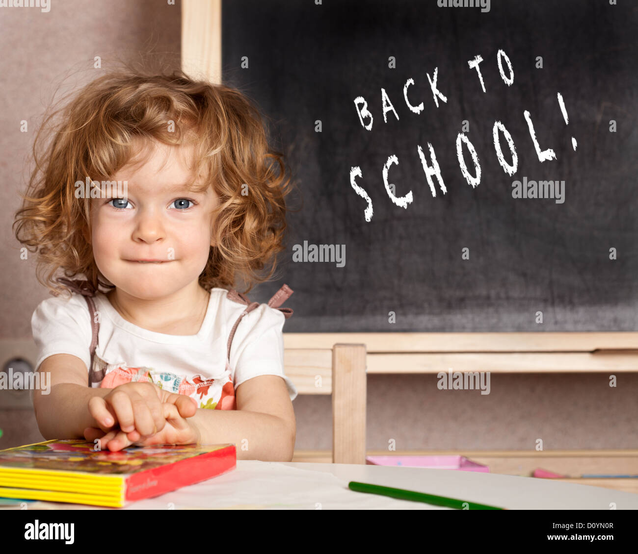 Smiling schoolchild in a class Stock Photo - Alamy