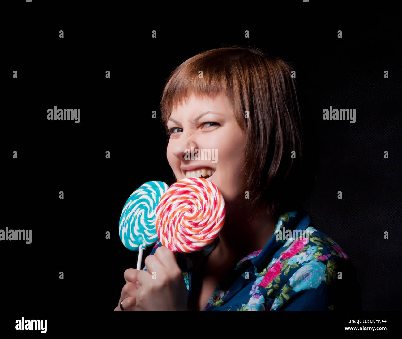 young woman with lollipop Stock Photo - Alamy