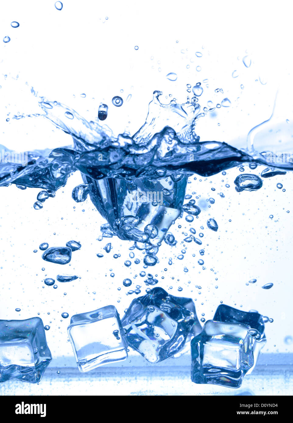 ice cubes dropped into water with splash Stock Photo - Alamy