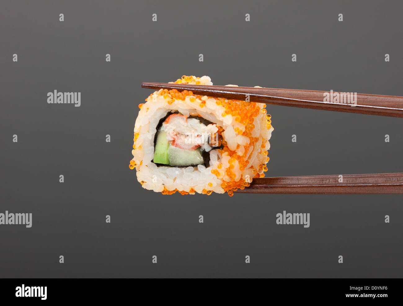 Sushi with chopsticks Stock Photo - Alamy