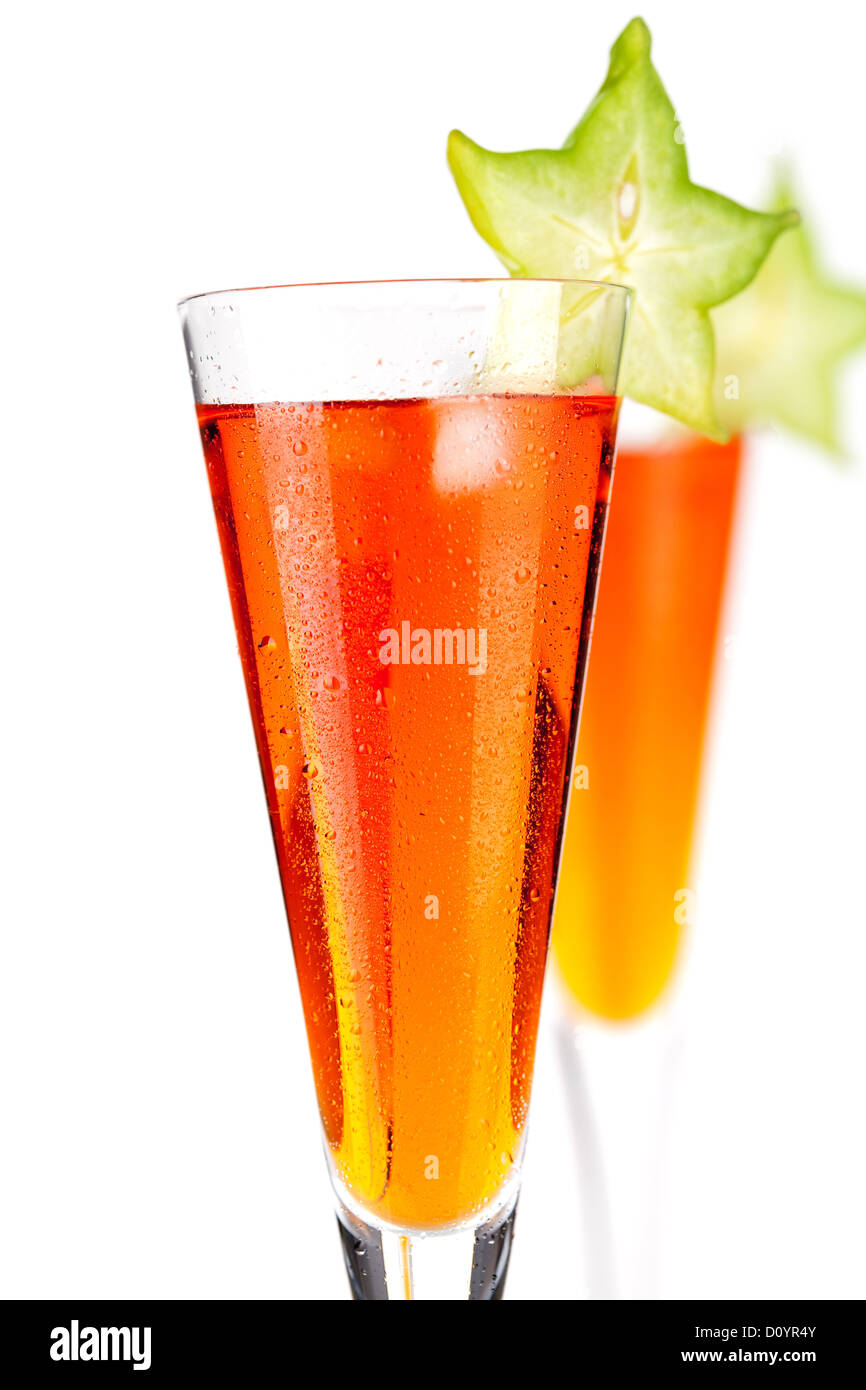 Orange alcohol cocktail with carambola isolated on white background ...