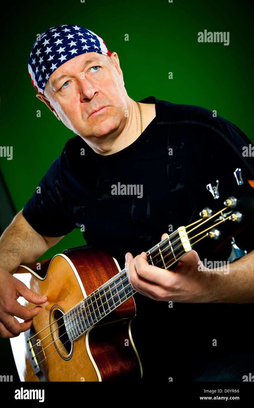 man with a guitar, bass player Stock Photo - Alamy
