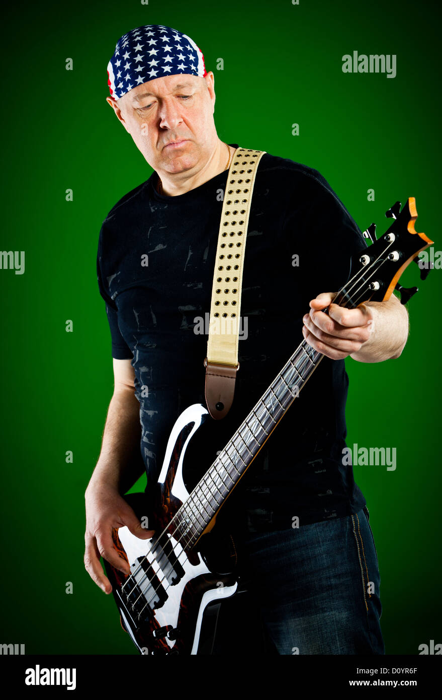 man with a guitar, bass player Stock Photo - Alamy