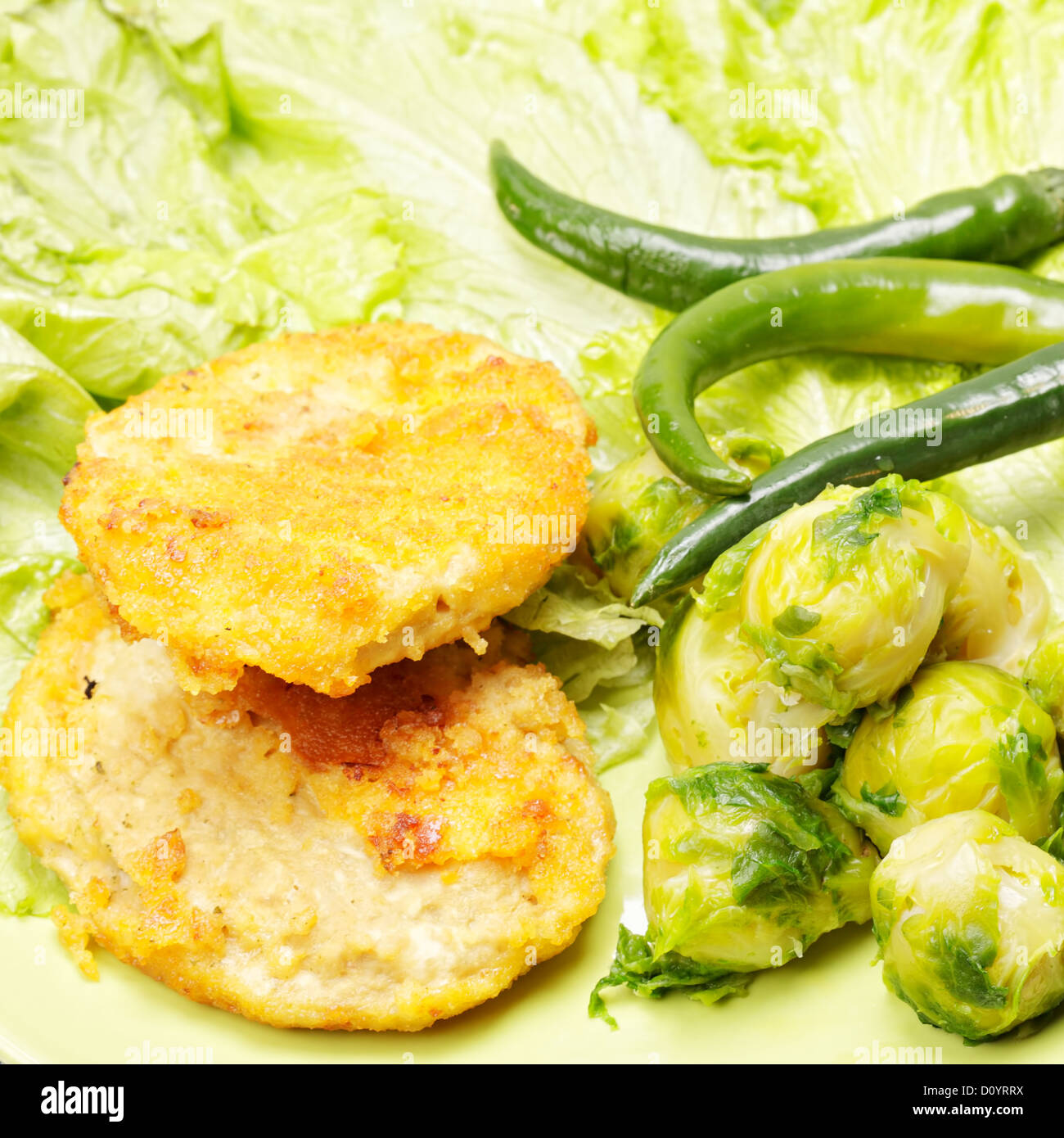 Cutlets with brussels sprout and chili Stock Photo - Alamy