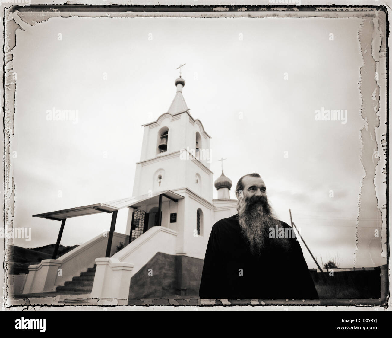 Priest standing in front of his church in Buryatia, Russia Stock Photo ...
