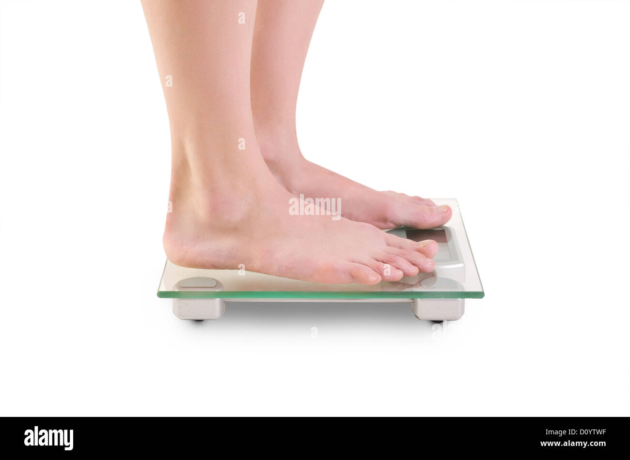 Woman legs on scales Stock Photo - Alamy