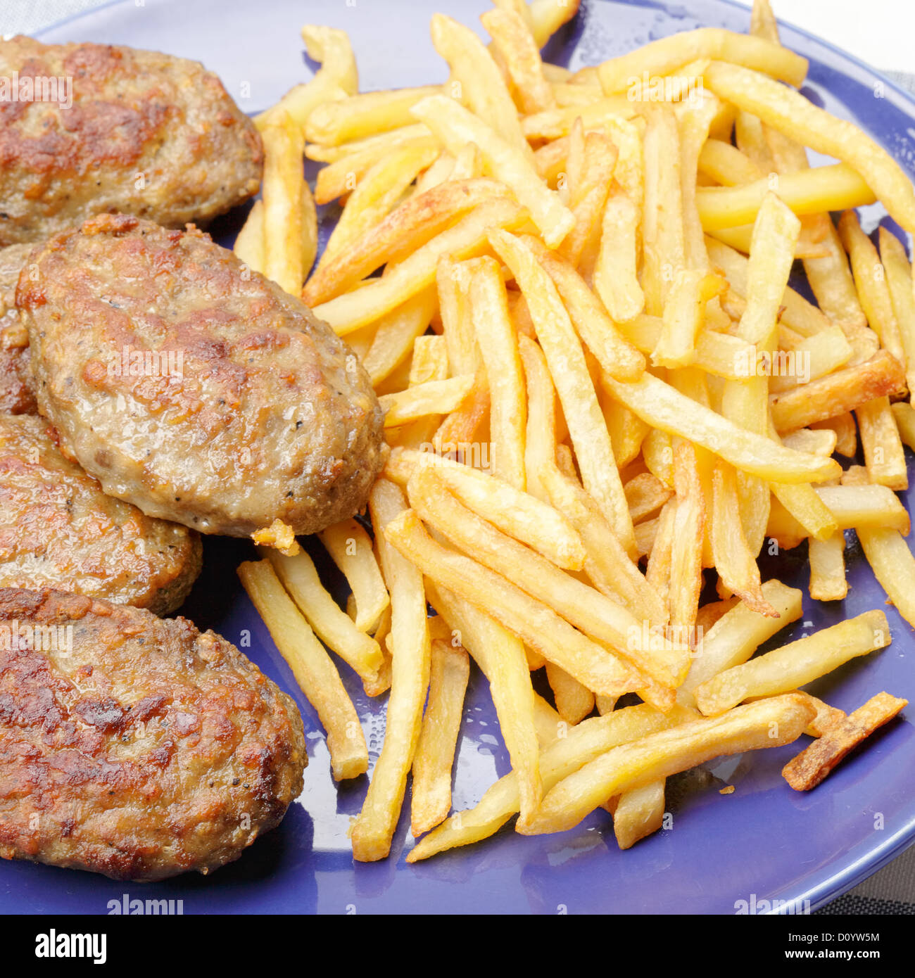 Cutlets with french fries Stock Photo - Alamy
