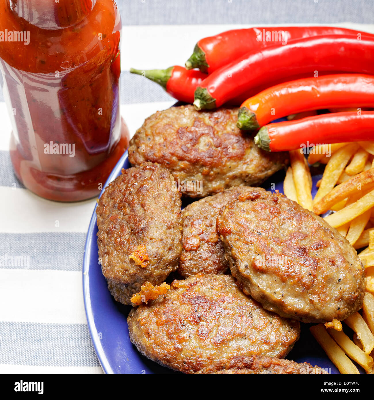 Cutlets with french fries and sauce Stock Photo - Alamy
