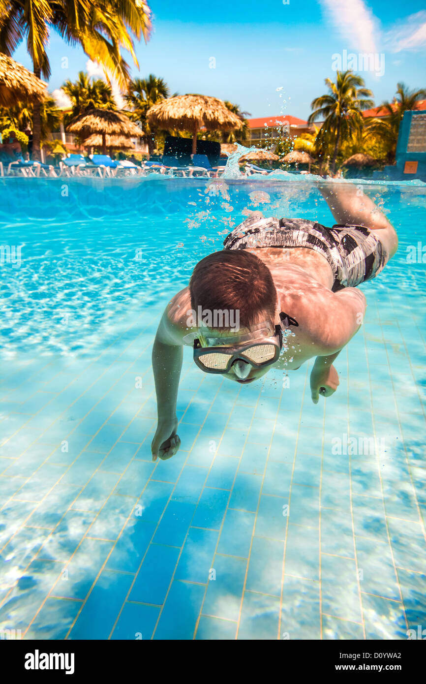 Teenager floats in pool hi-res stock photography and images - Alamy