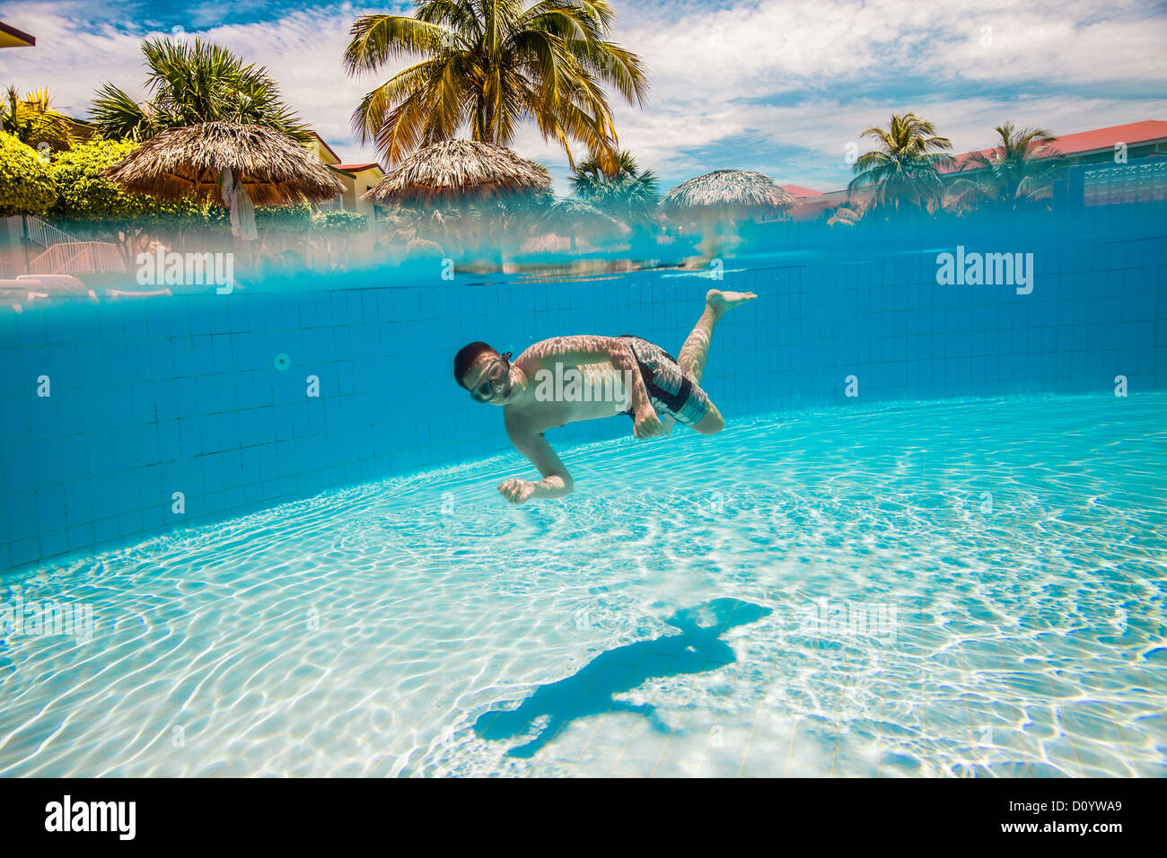 Teenager floats in pool hi-res stock photography and images - Alamy