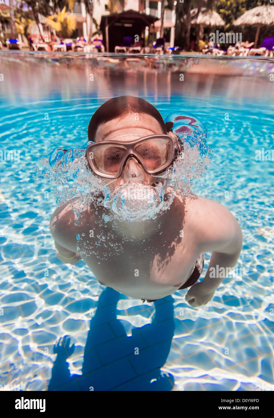 Teenager floats in pool hi-res stock photography and images - Alamy
