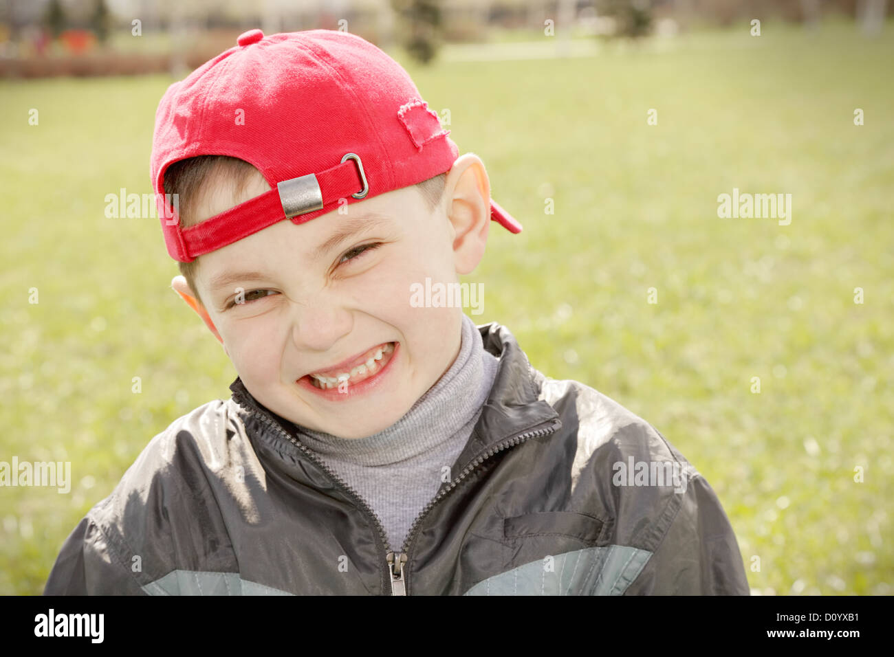 Smiling kid in red cap Stock Photo - Alamy