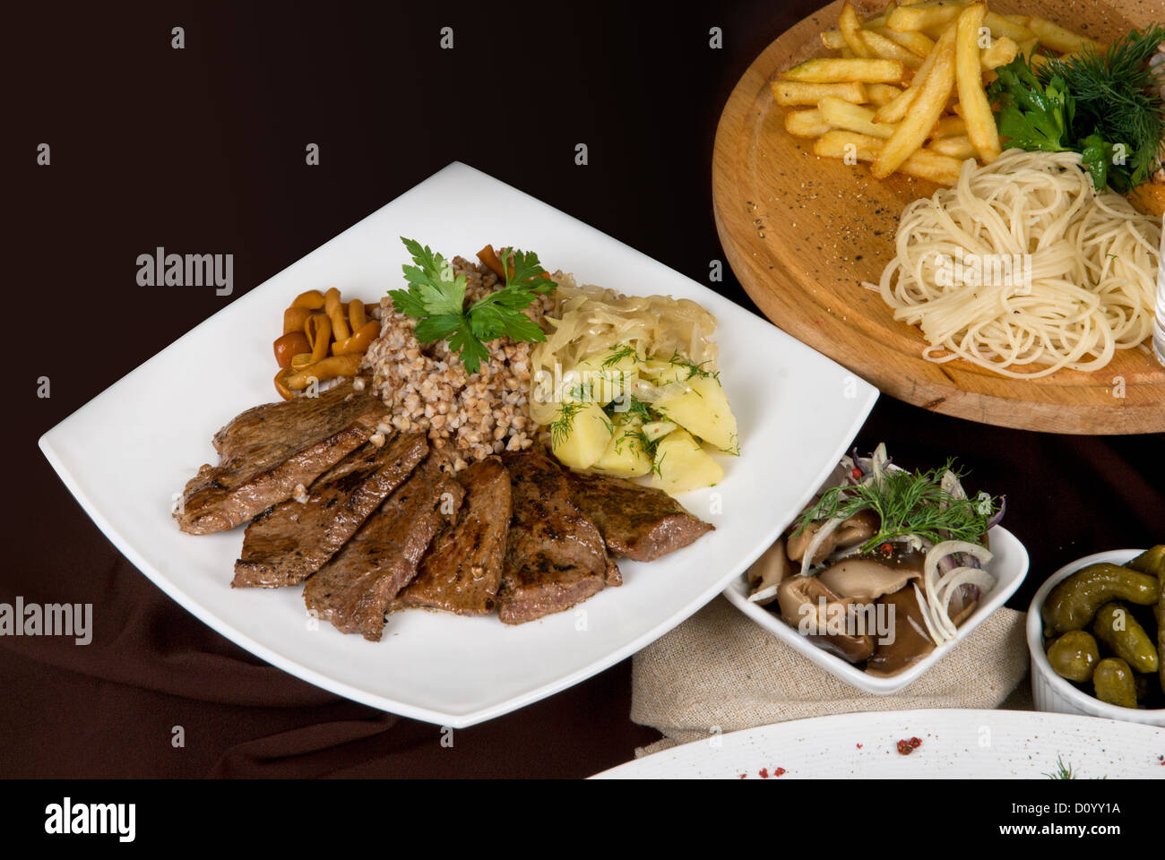 Meat dish at the table Stock Photo - Alamy