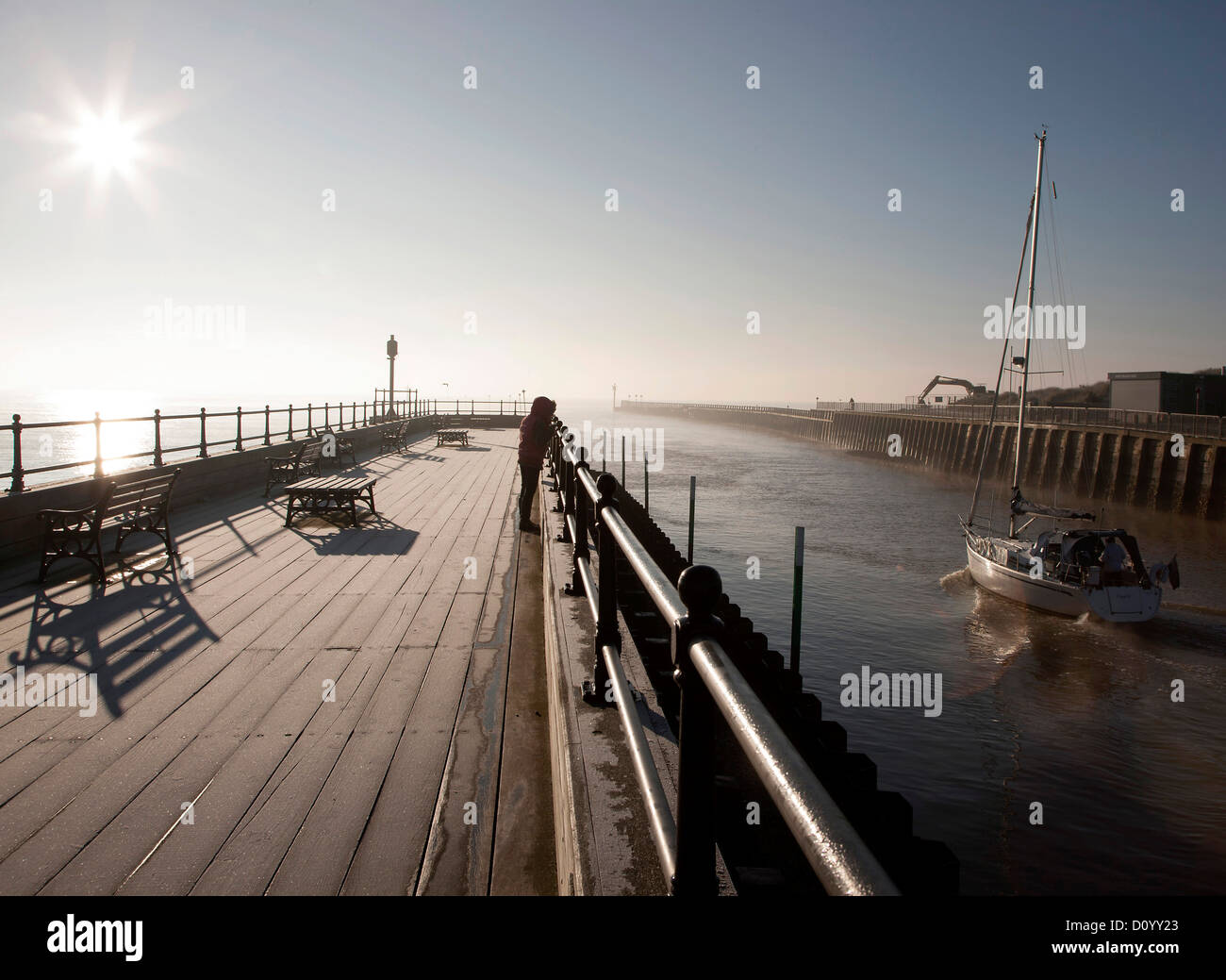 A lady in silhouette on a frosty Littlehampton Pier Stock Photo - Alamy