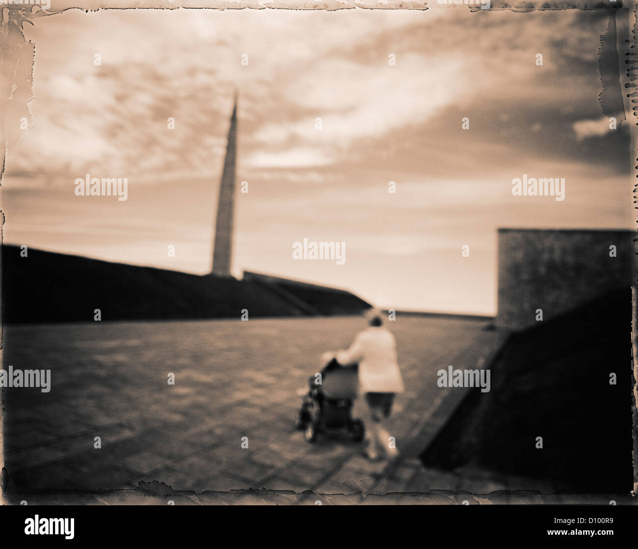 Soft focus image of mother and baby carriage in architectural limbo ...