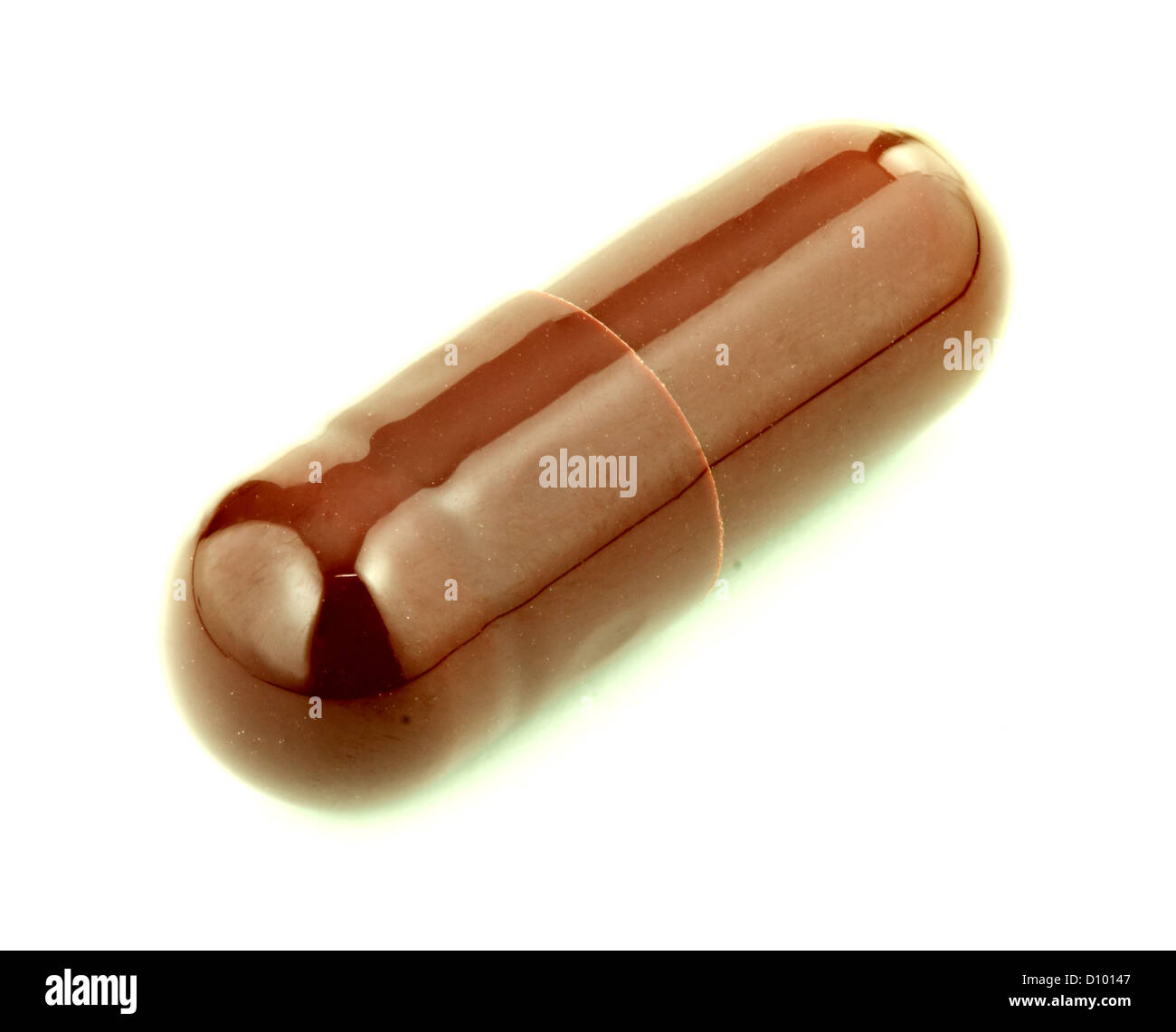 close-up of brown pill on white backround Stock Photo - Alamy