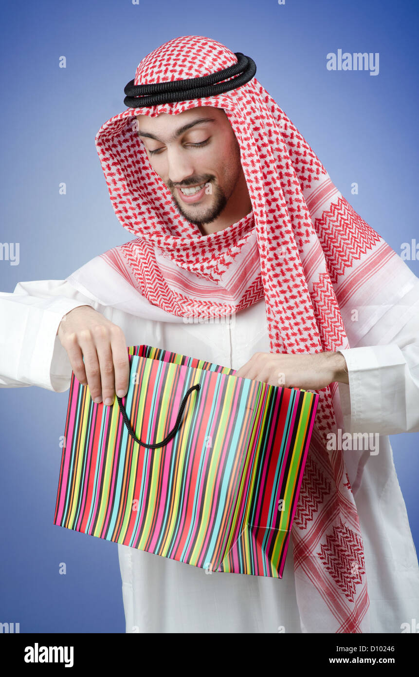 Arab with the gift bags Stock Photo - Alamy