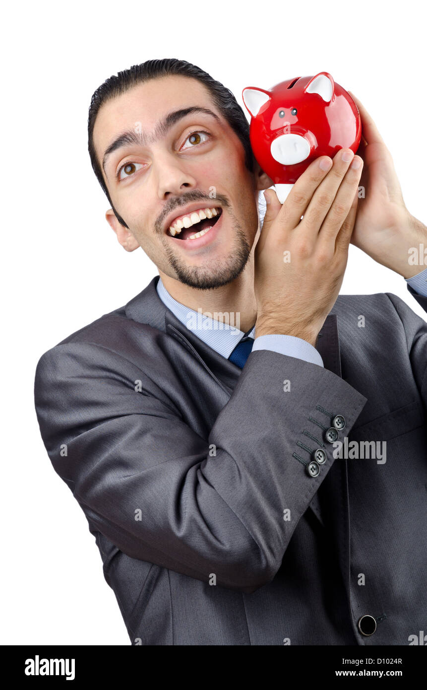 Man saving his money in the piggybank Stock Photo - Alamy
