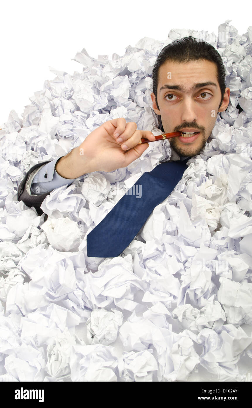 Man with lots of waste paper Stock Photo - Alamy