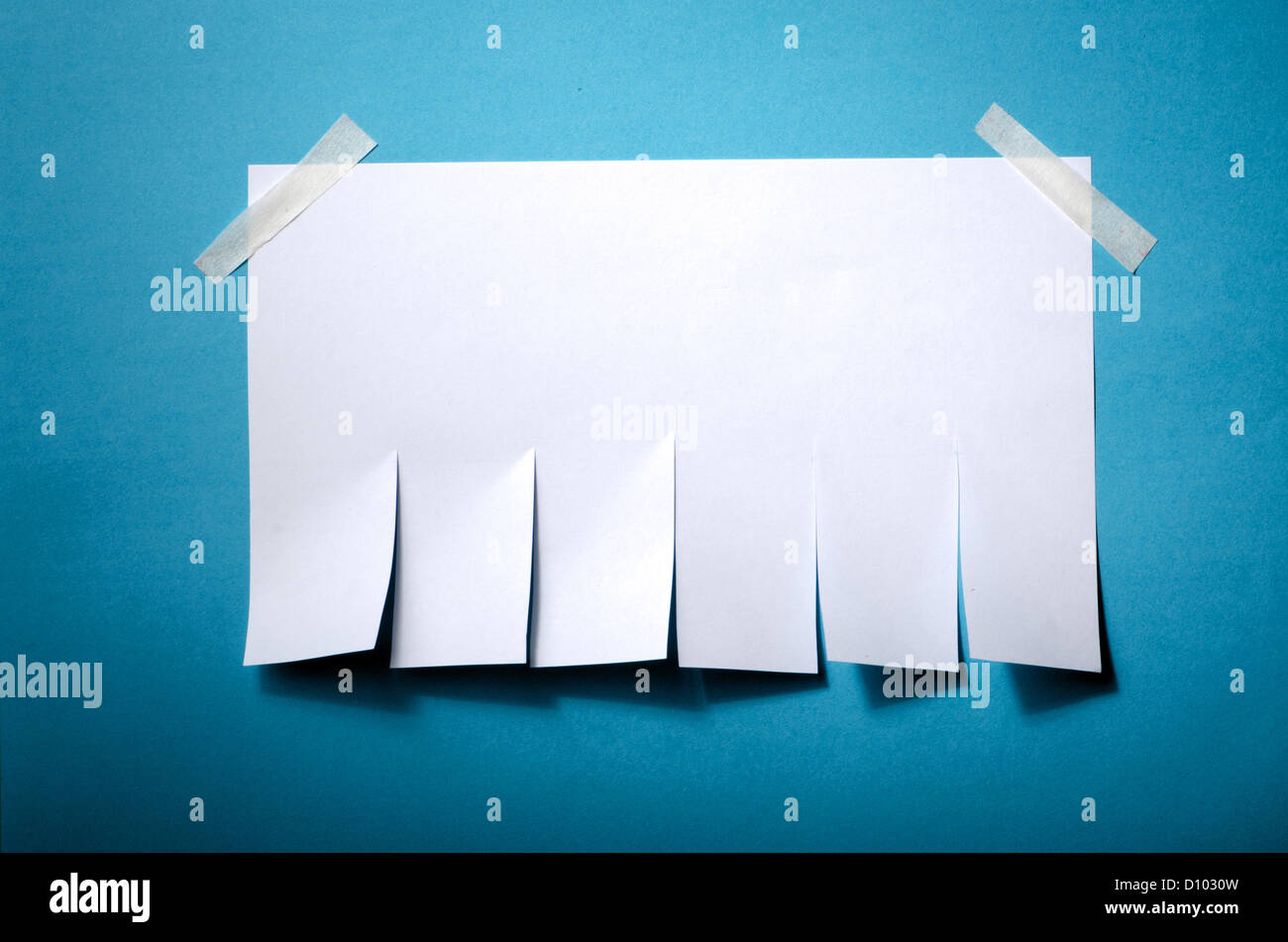 Tear off paper notice on the wall Stock Photo - Alamy