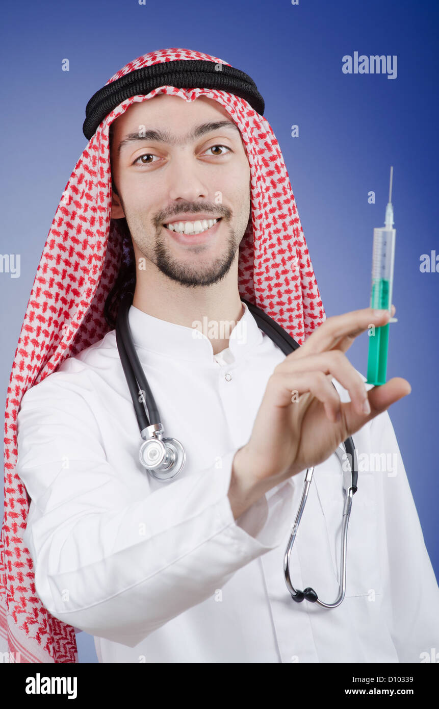 Arab doctor with syringe Stock Photo - Alamy