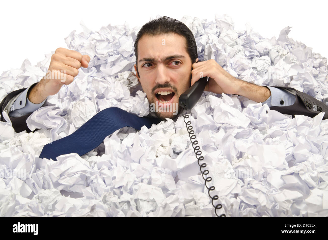 Man with lots of crumpled paper Stock Photo - Alamy