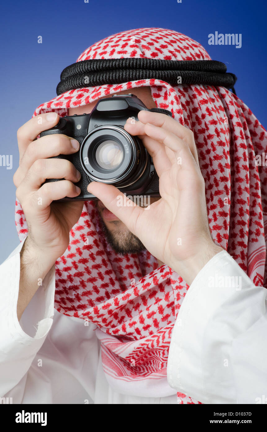 Arab photographer in studio shooting Stock Photo - Alamy