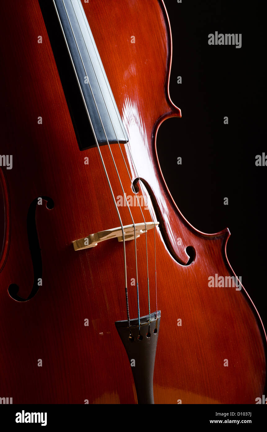 Music Cello in the dark room Stock Photo - Alamy