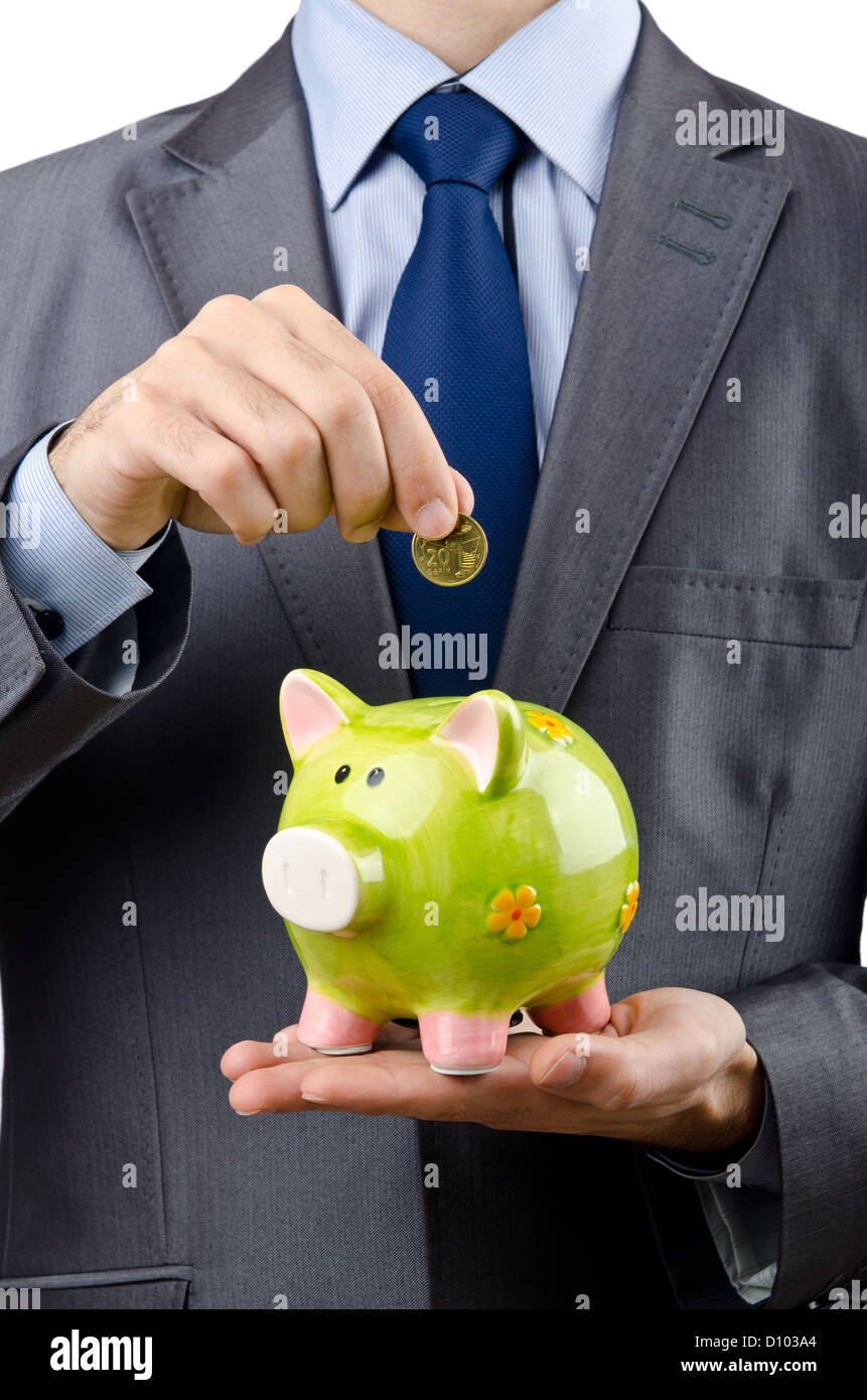Man saving his money in the piggybank Stock Photo - Alamy