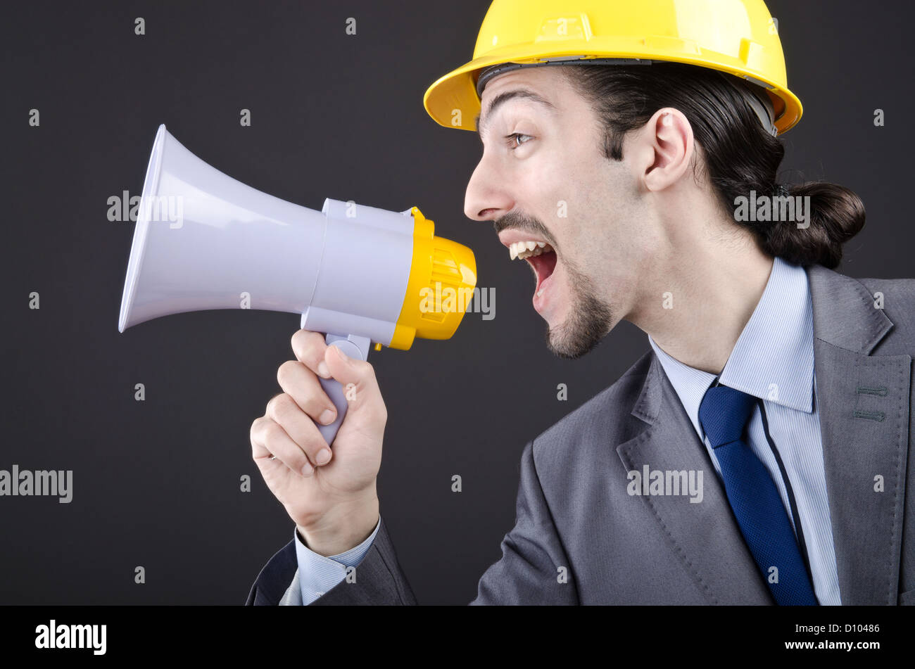 Man shouting and yelling with loudspeaker Stock Photo - Alamy