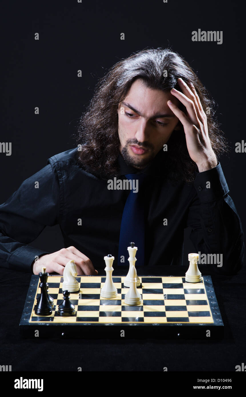 Chess player playing his game Stock Photo - Alamy