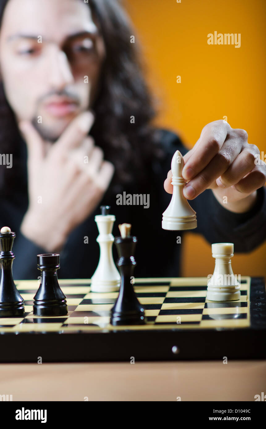Chess player playing his game Stock Photo - Alamy