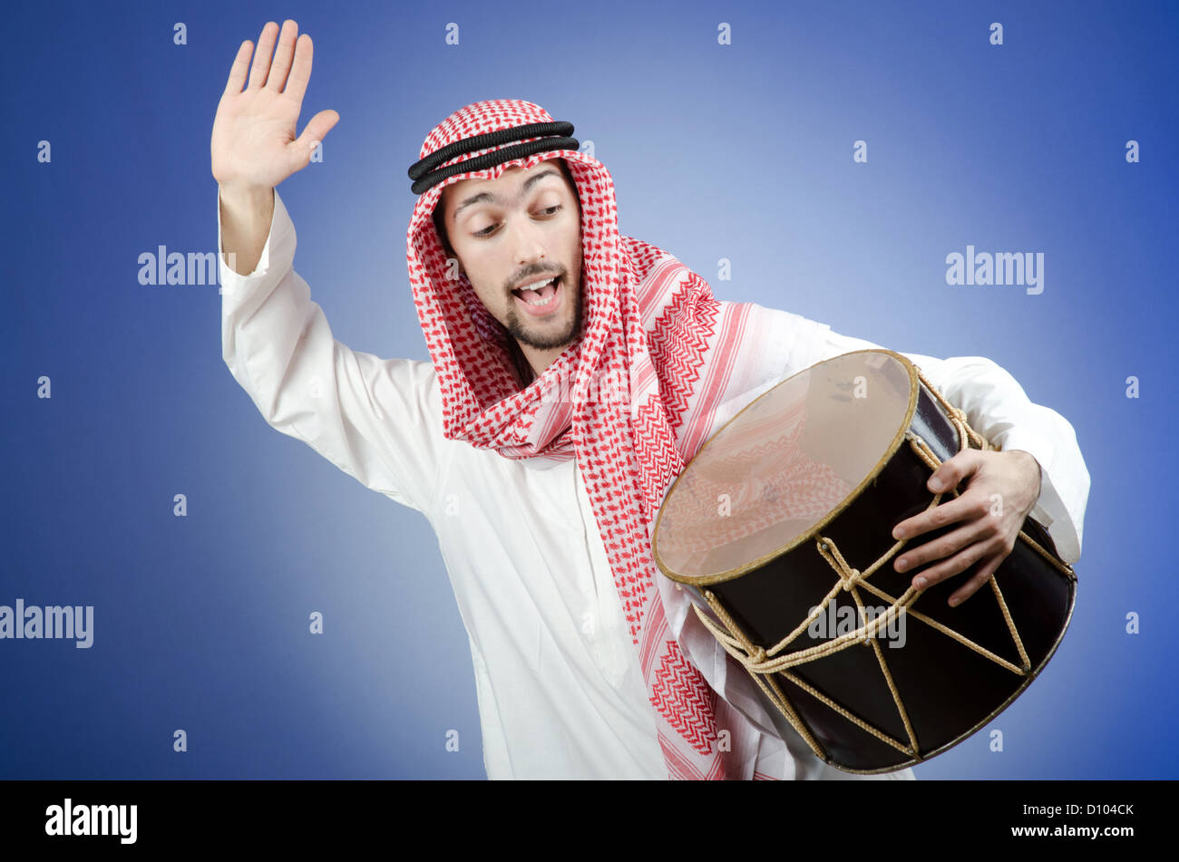 Arab playing drum in studio shooting Stock Photo - Alamy