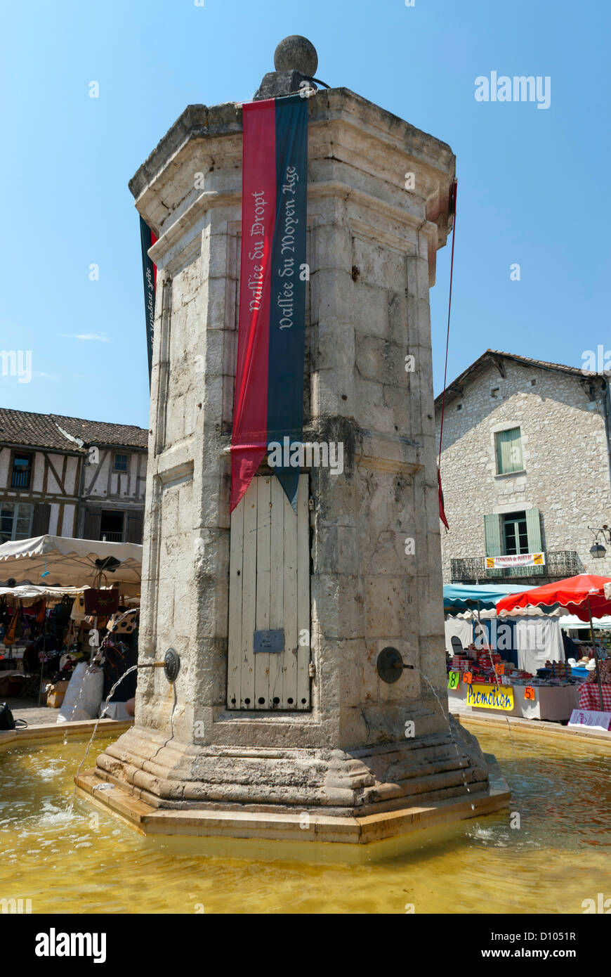 Fountain in the traditional main square in Eymet, in the Dordogne ...