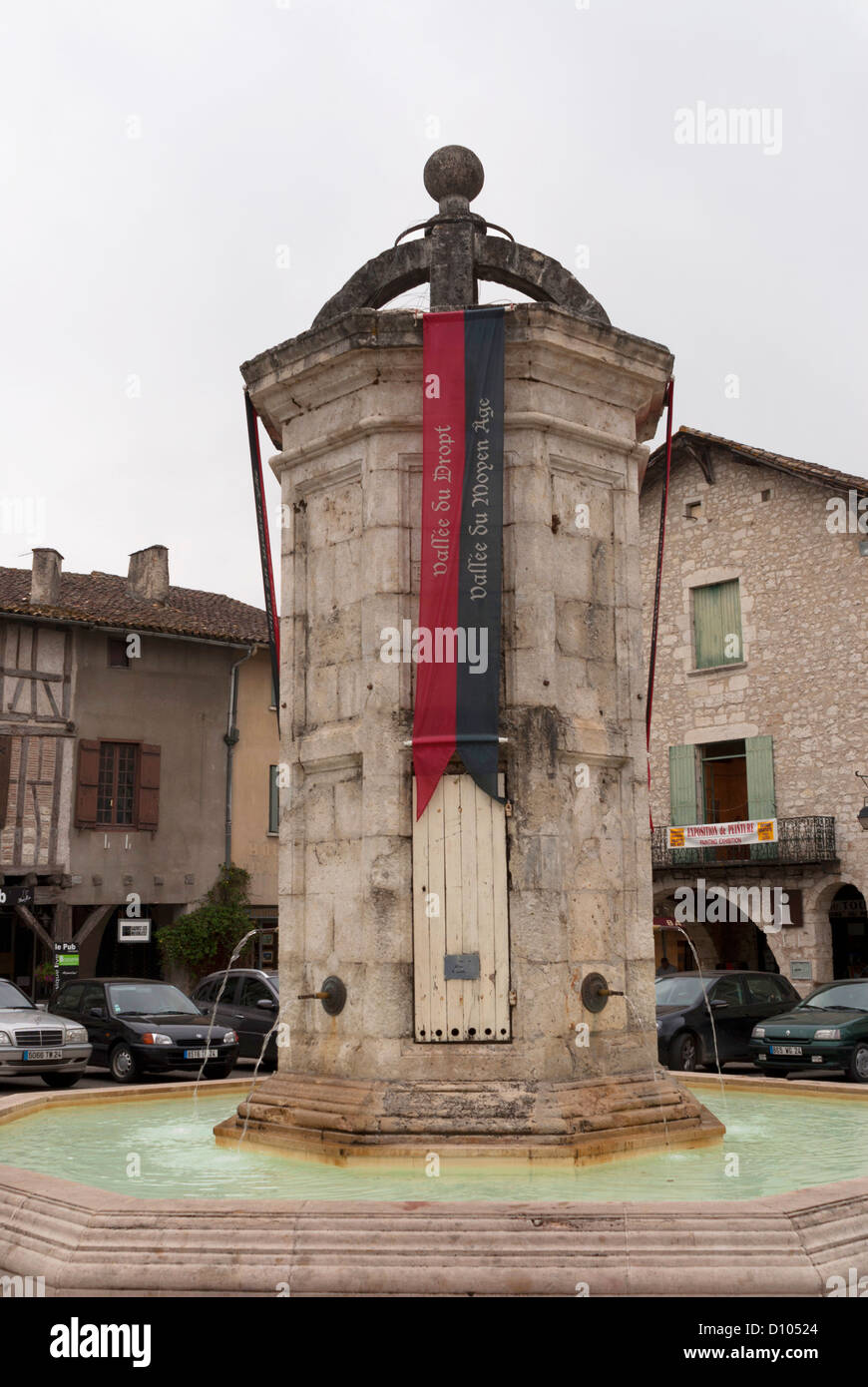 Fountain in the traditional main square in Eymet, in the Dordogne ...