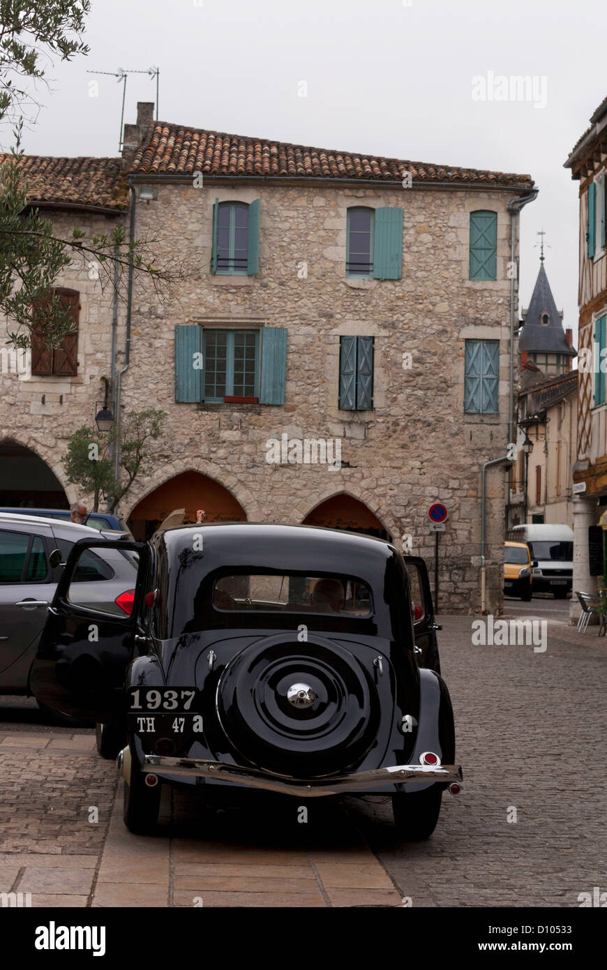 An old car in the main square in Eymet, in the Dordogne region of ...