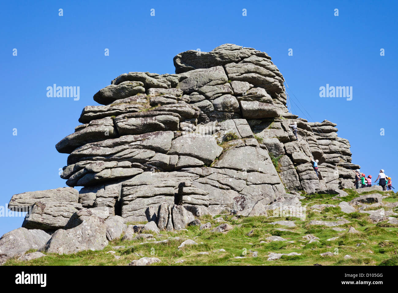 England, Devon, Dartmoor, School Children Climbing Hound Tor Stock ...