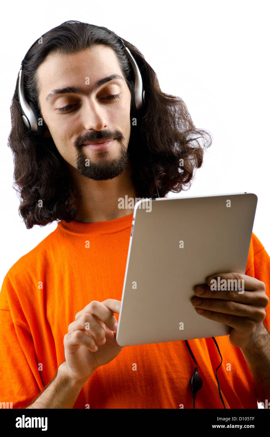 Student listening music with tablet computer Stock Photo - Alamy