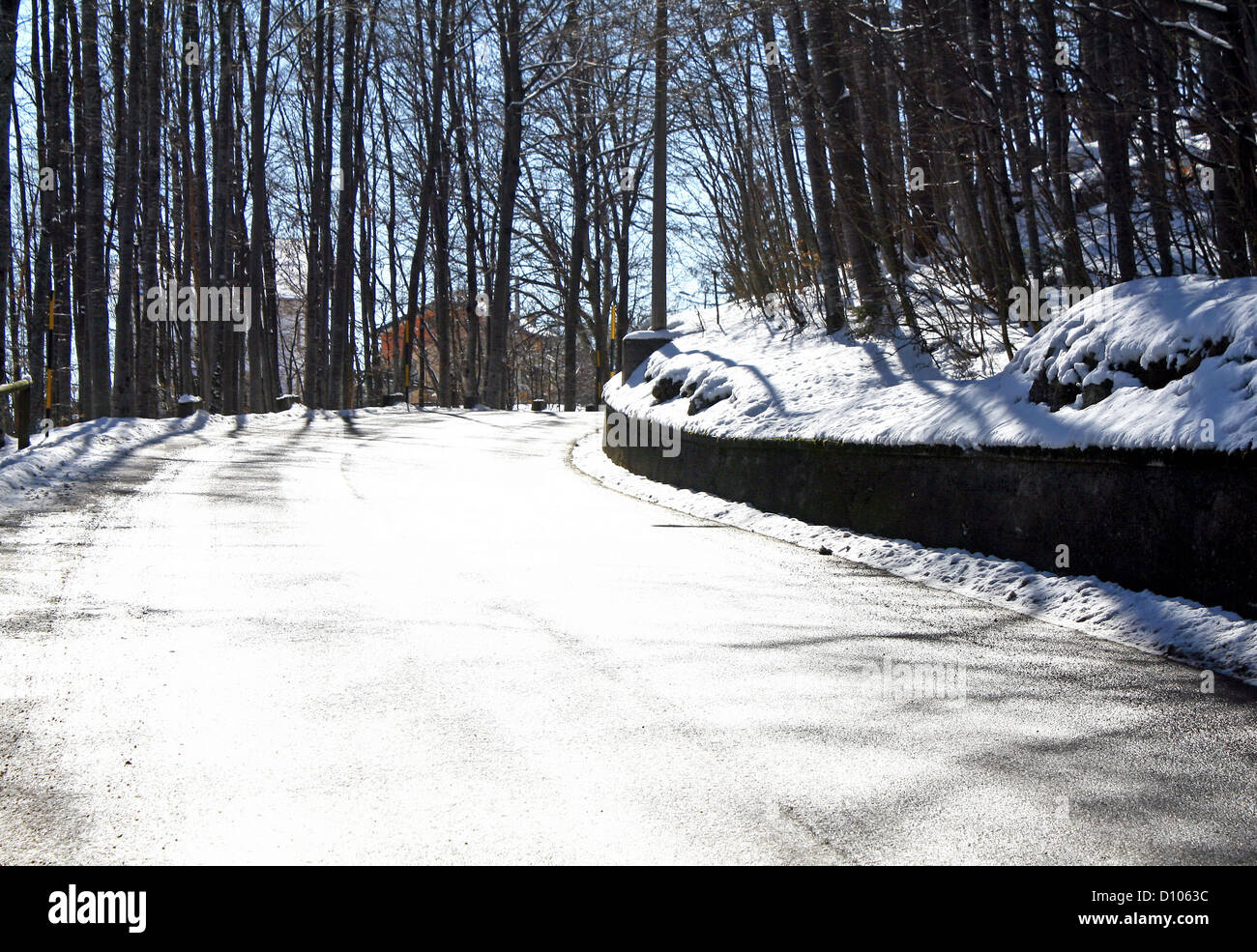 Street in winter with snow and ice pose very dangerous Stock Photo - Alamy