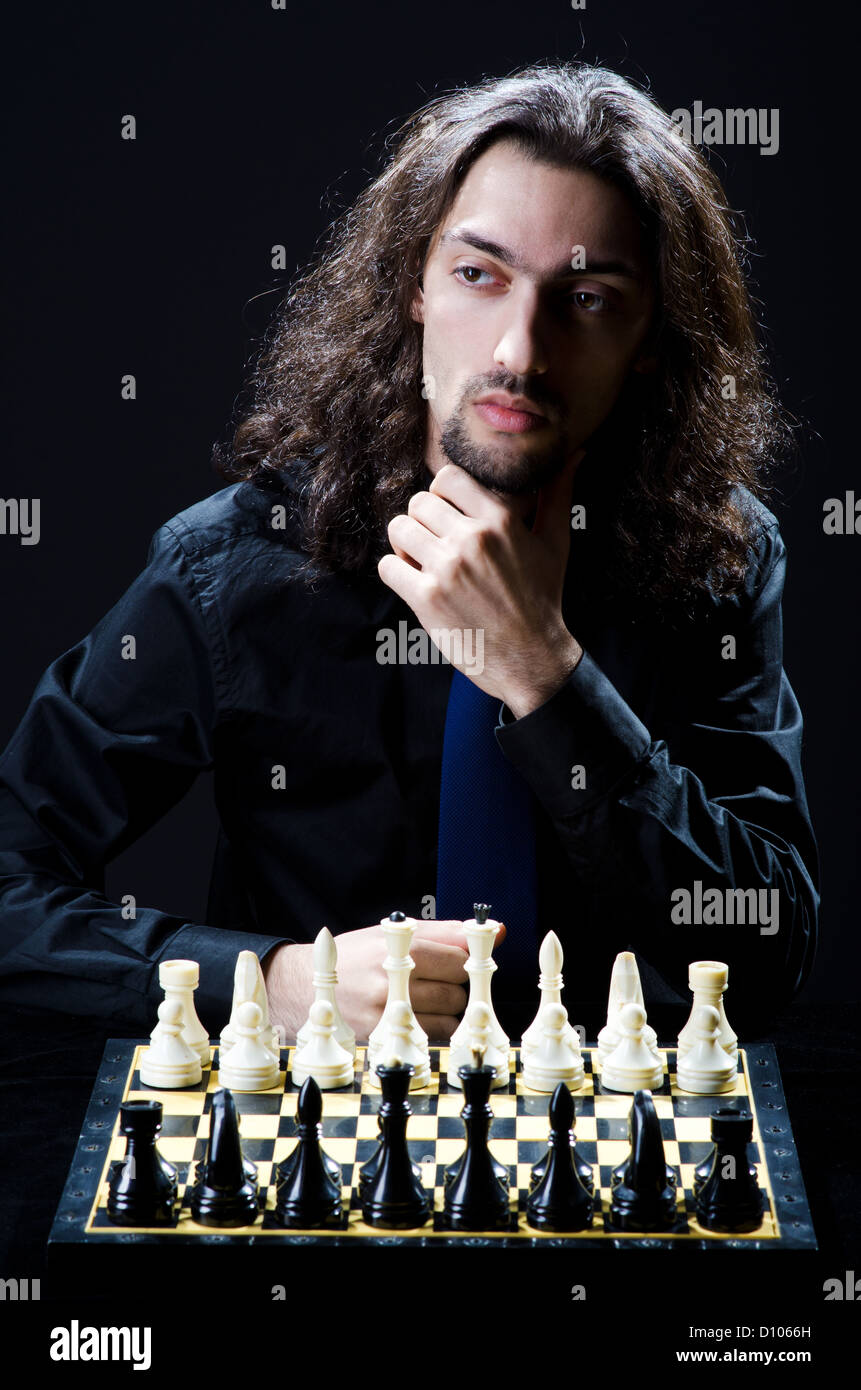 Chess player playing his game Stock Photo - Alamy